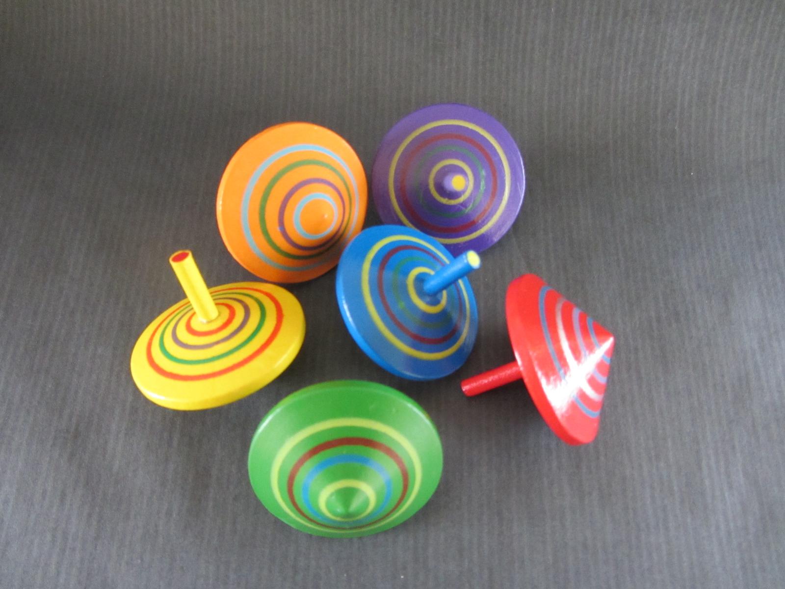 A lovely set of Wooden Mini Spinning Tops - 6 per pack.
